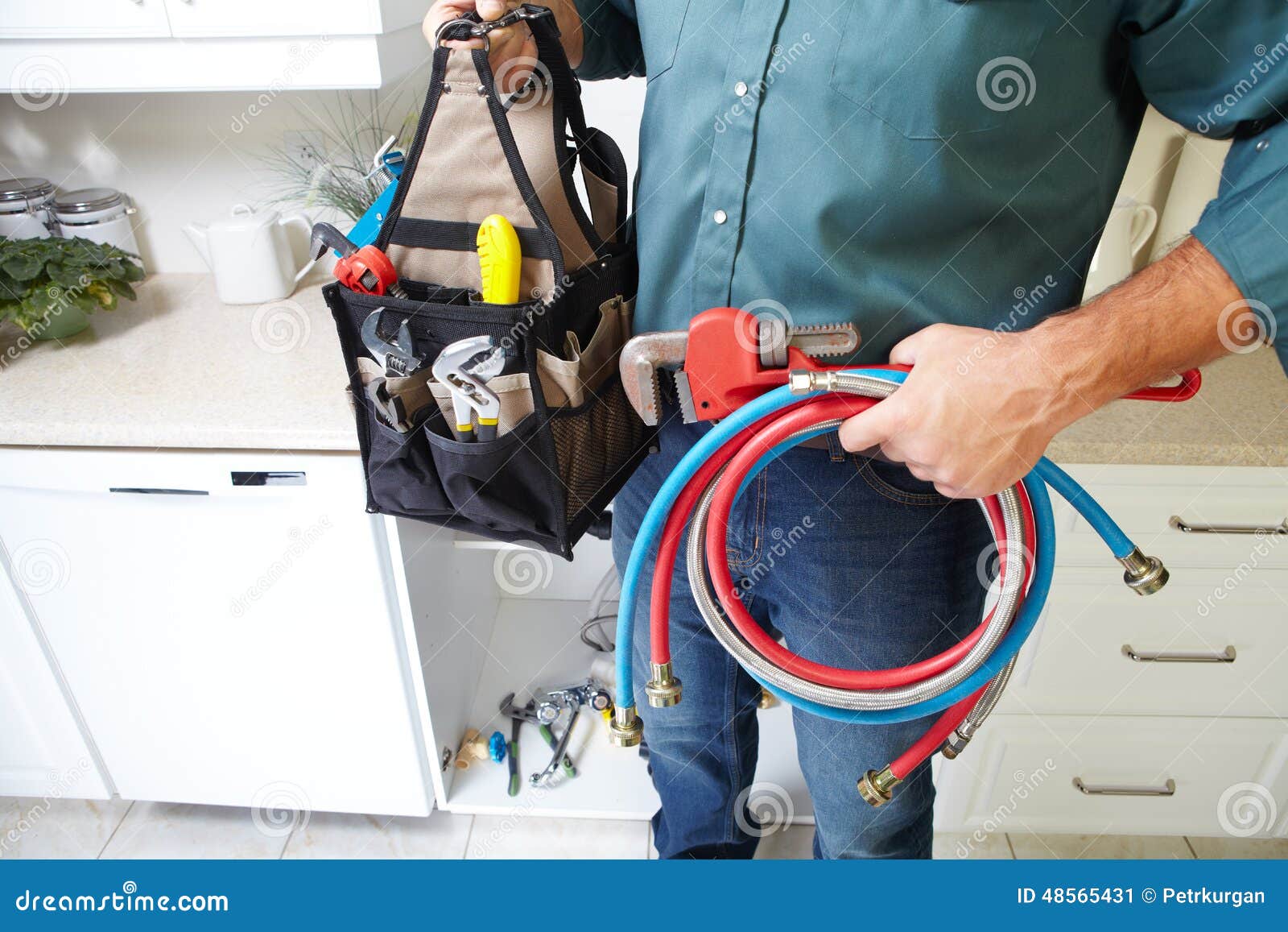 Plumber on the kitchen. stock image. Image of renovation - 48565431
