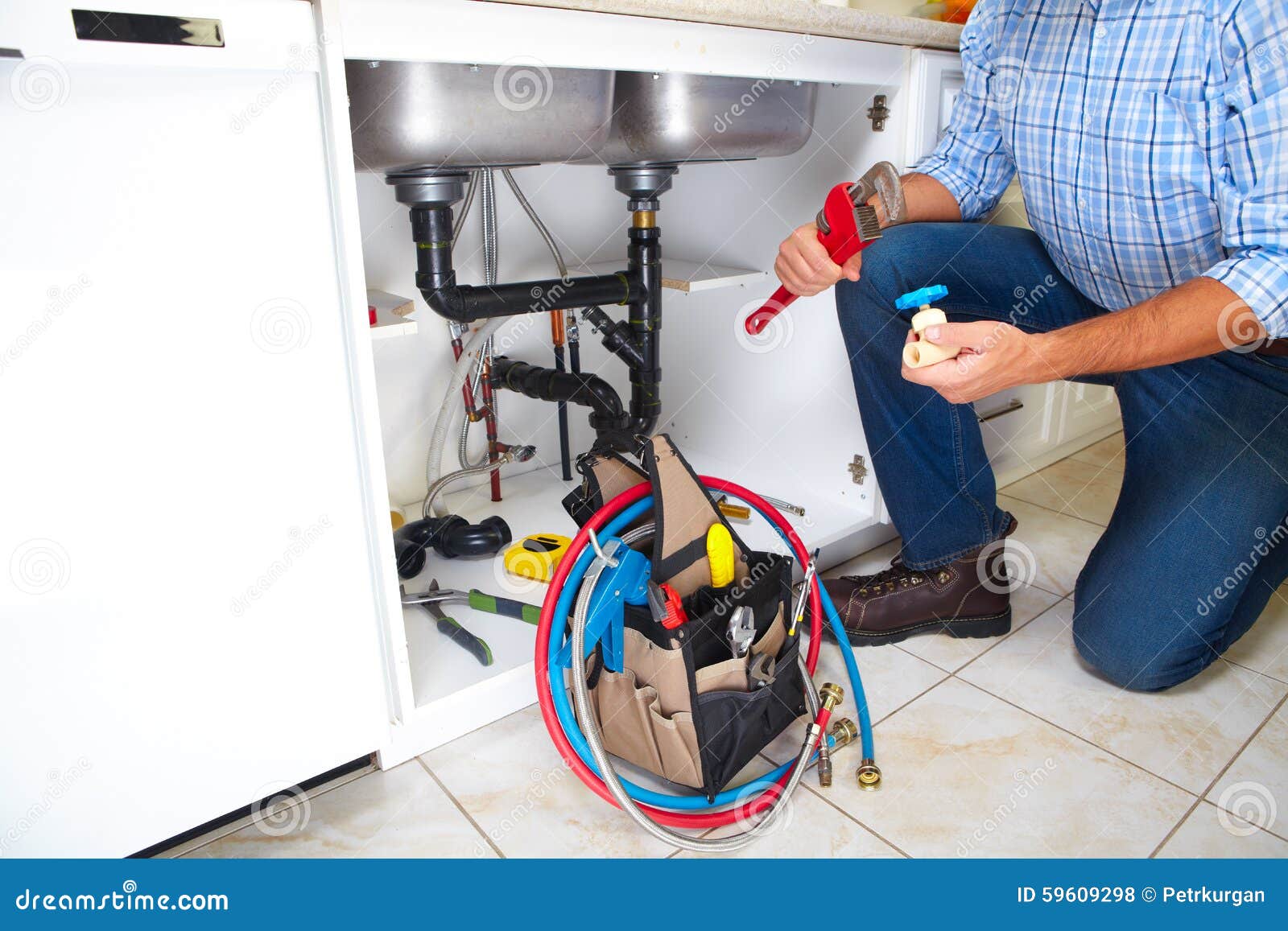 Plumber on the kitchen. stock photo. Image of carpenter - 59609298