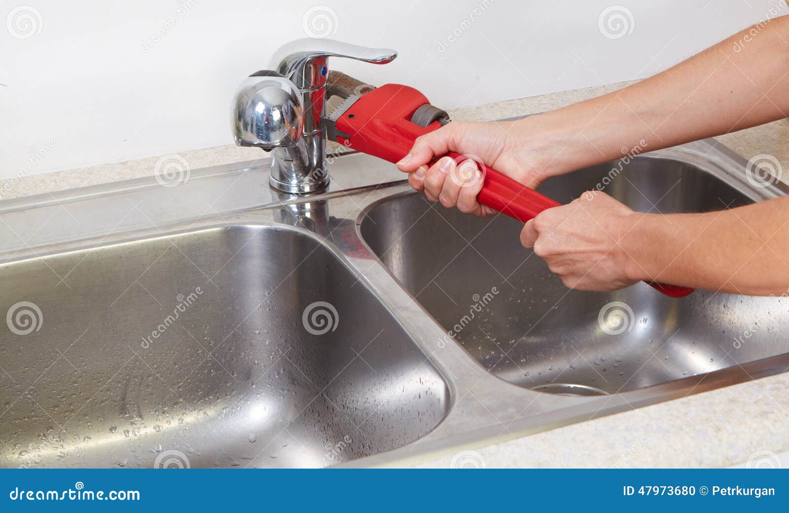 Plumber on the kitchen. stock photo. Image of renewal - 47973680