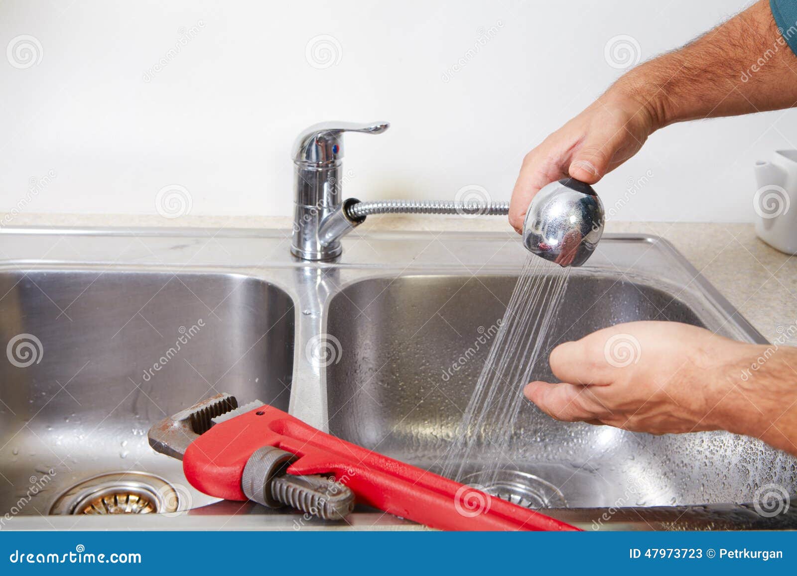 Plumber on the kitchen. stock image. Image of kitchen - 47973723