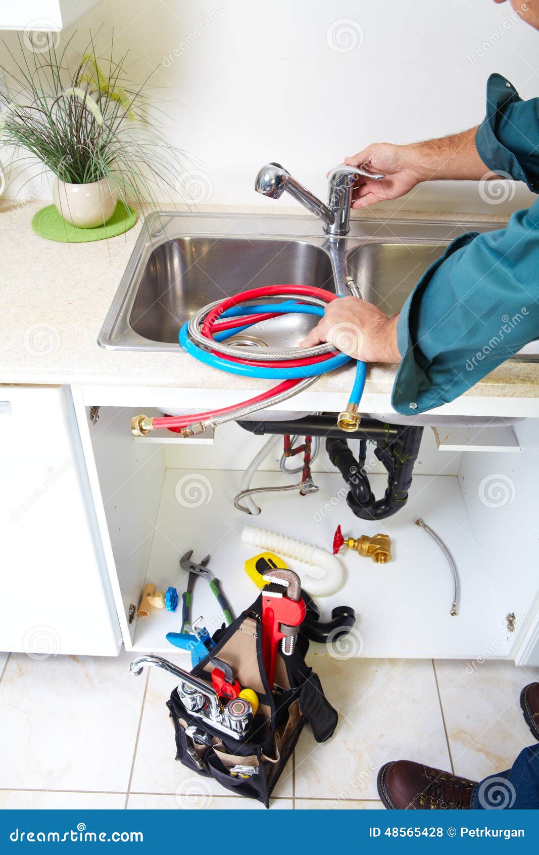 Plumber on the kitchen. stock photo. Image of hand, plumbing - 48565428