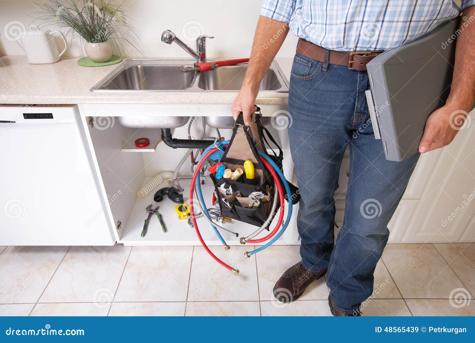 Plumber on the kitchen. stock image. Image of male, pipe - 48565439