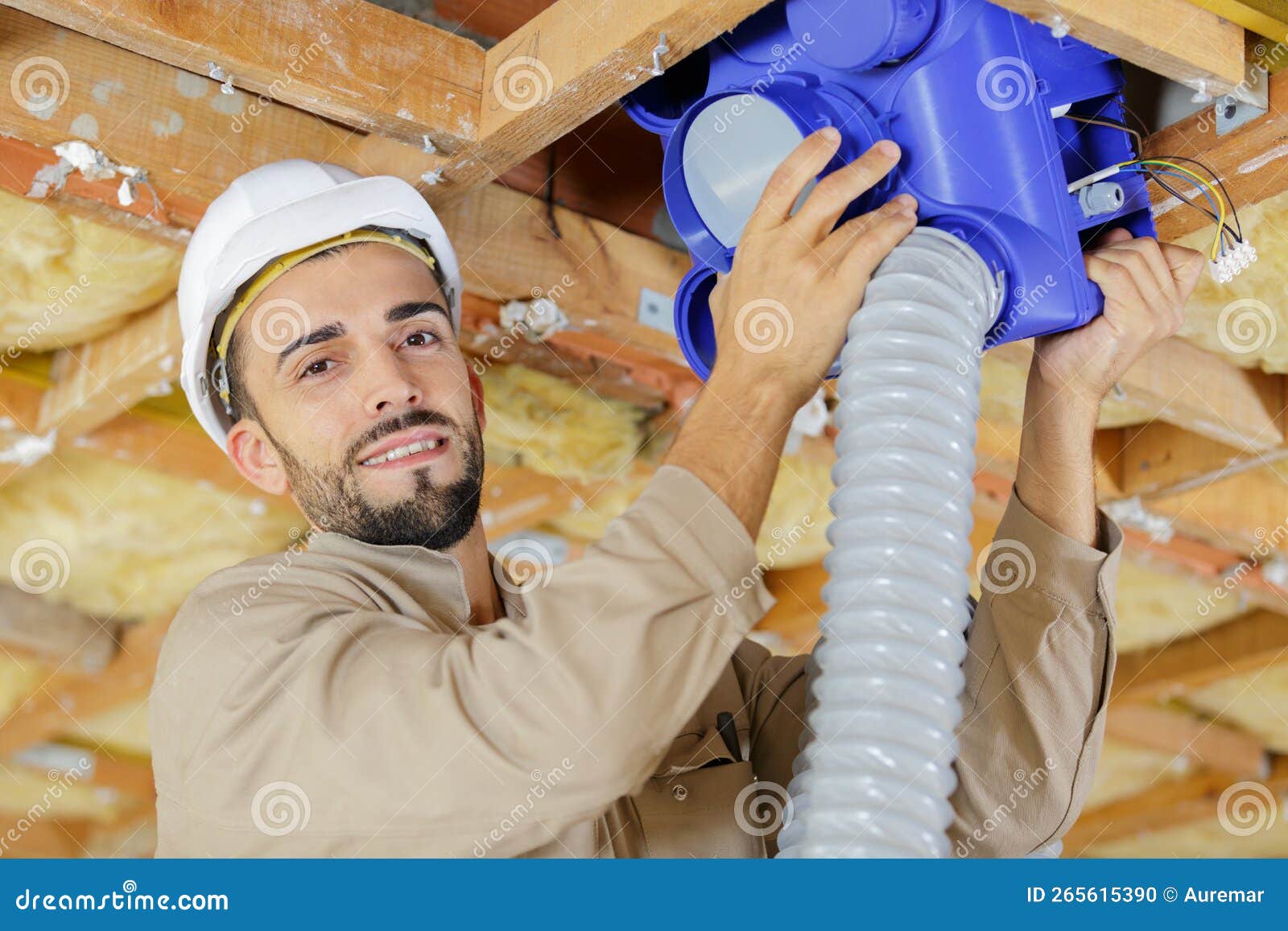 Plumber looking at camera stock photo. Image of pipes - 265615390