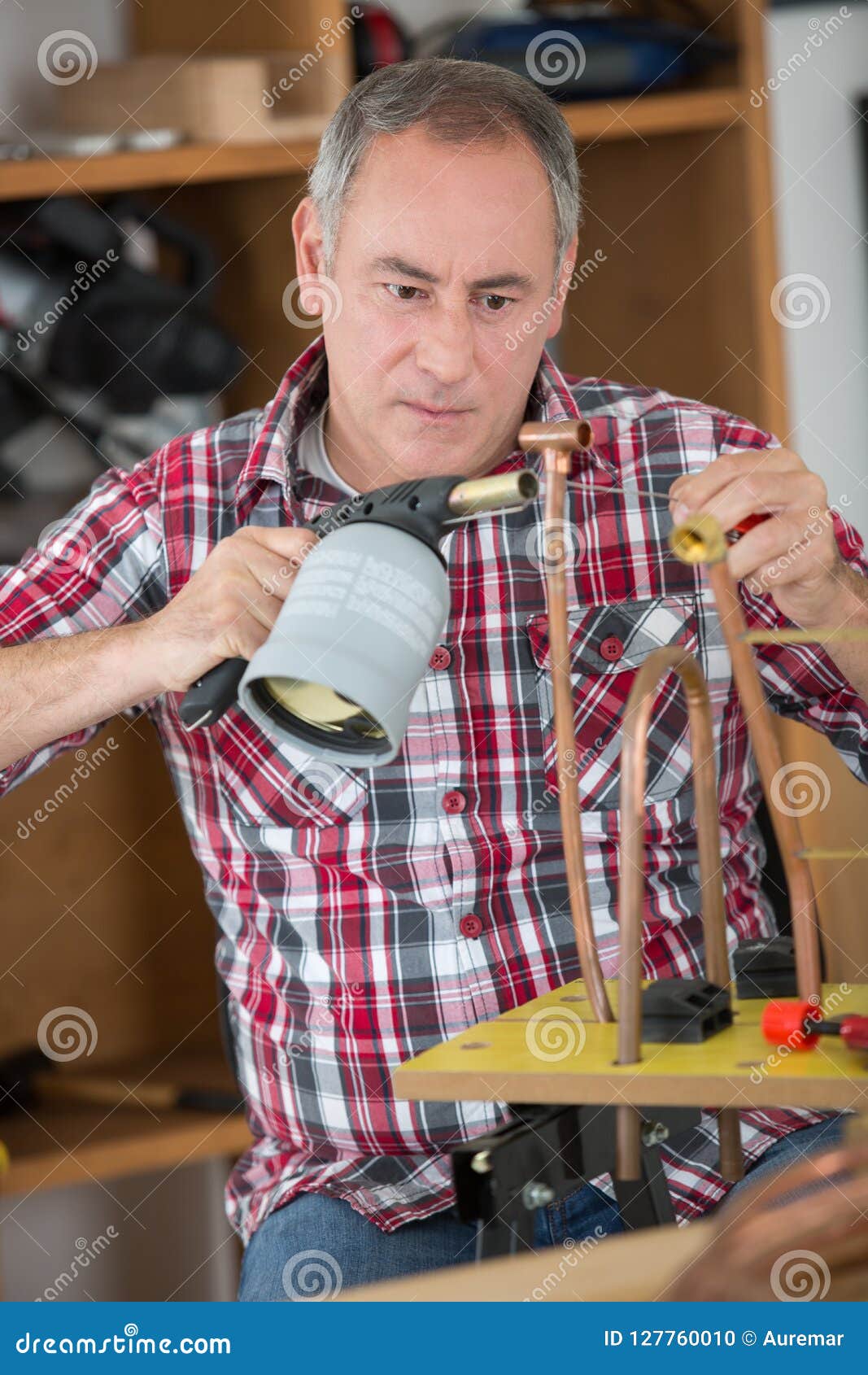 Plumber man with tools stock photo. Image of artisan - 127760010