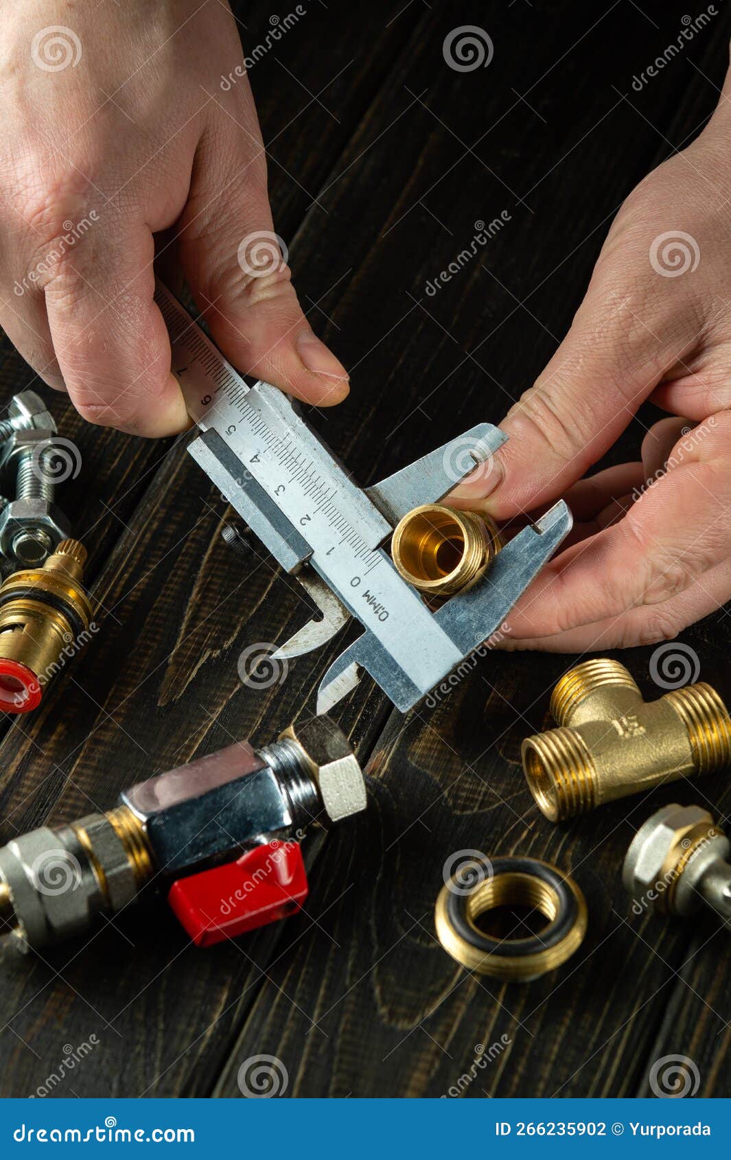 The Plumber Measures Diameter of Fitting with a Caliper. Working ...