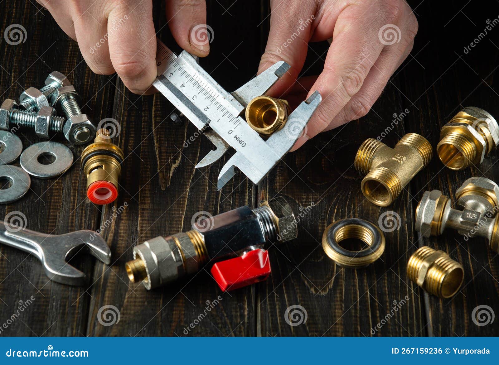 The Plumber Measures Diameter of Fitting with a Caliper. Working ...