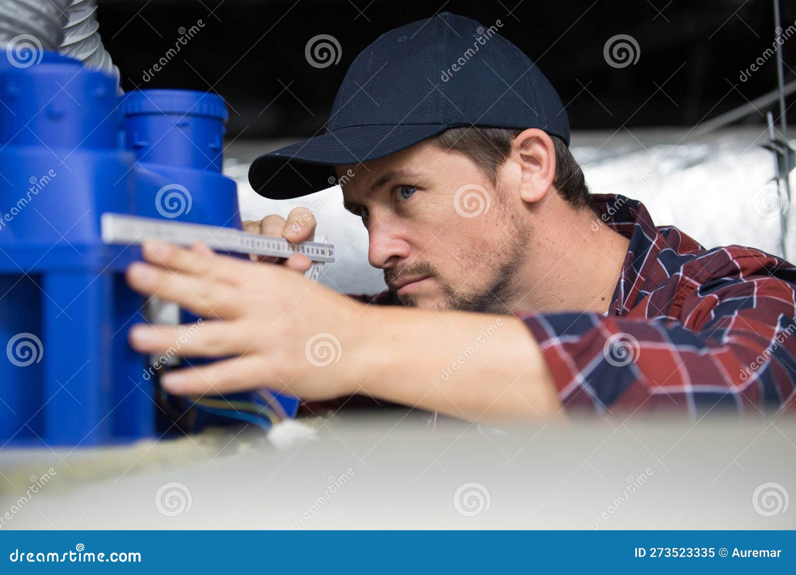 Plumber measuring pipe stock image. Image of operator - 273523335