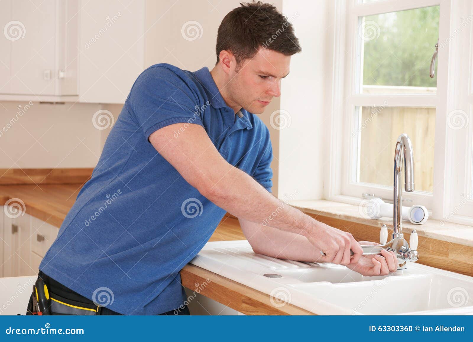 Plumber Mending Tap with Adjustable Wrench Stock Photo - Image of ...