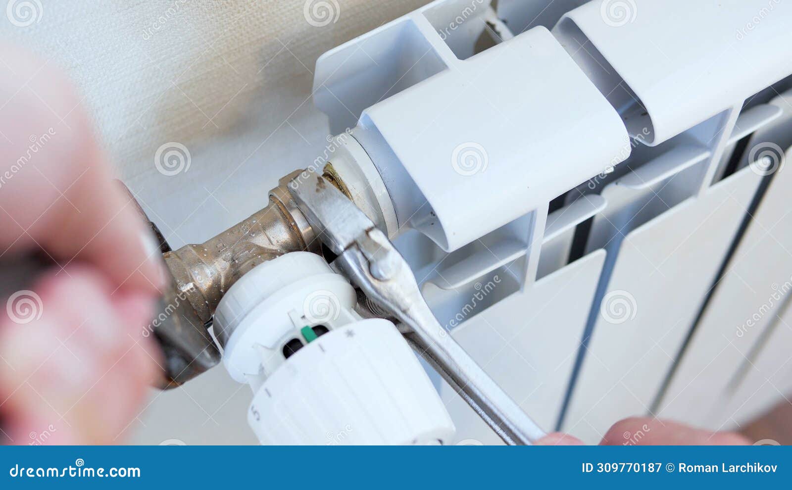 Plumber S Hands Install a Radiator with a Two Wrench. Man Installing ...