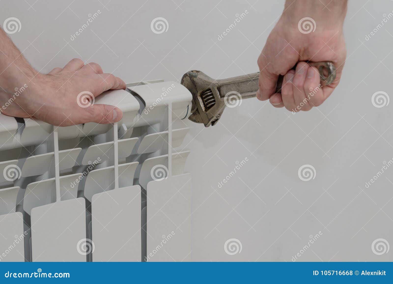 The Plumber`s Hands Install a Radiator Stock Photo - Image of hands ...