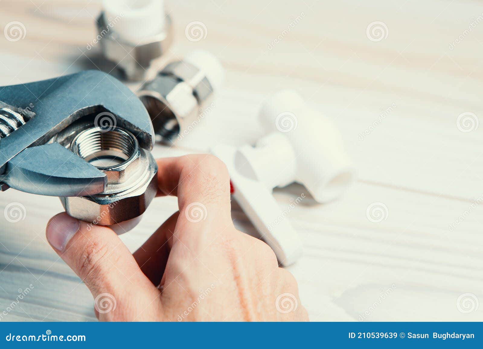 Plumber Screwing a Plumbing Fitting; Panoramic Banner Stock Image ...