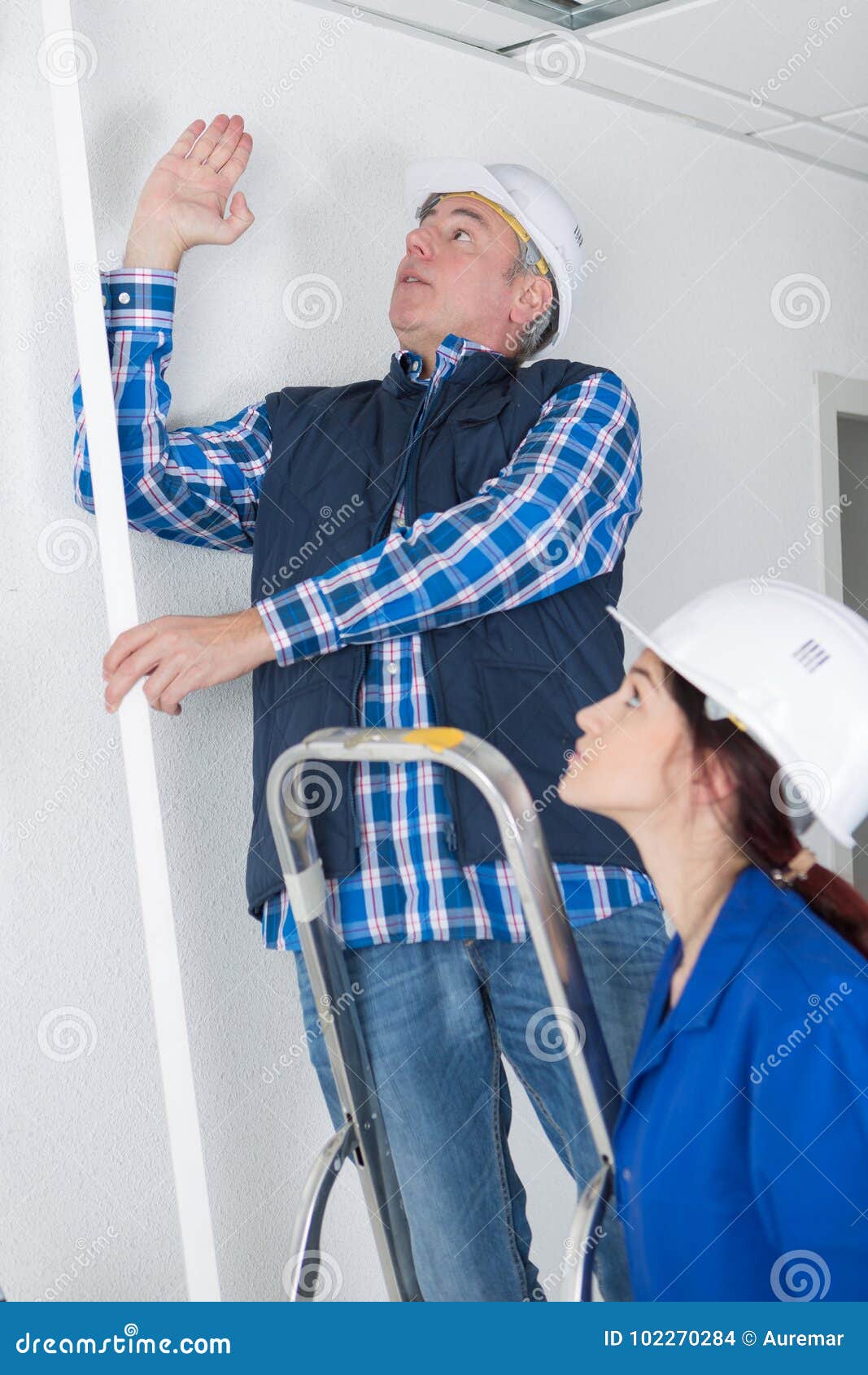 Plumber Showing Female Trainee Where To Work Stock Photo - Image of ...