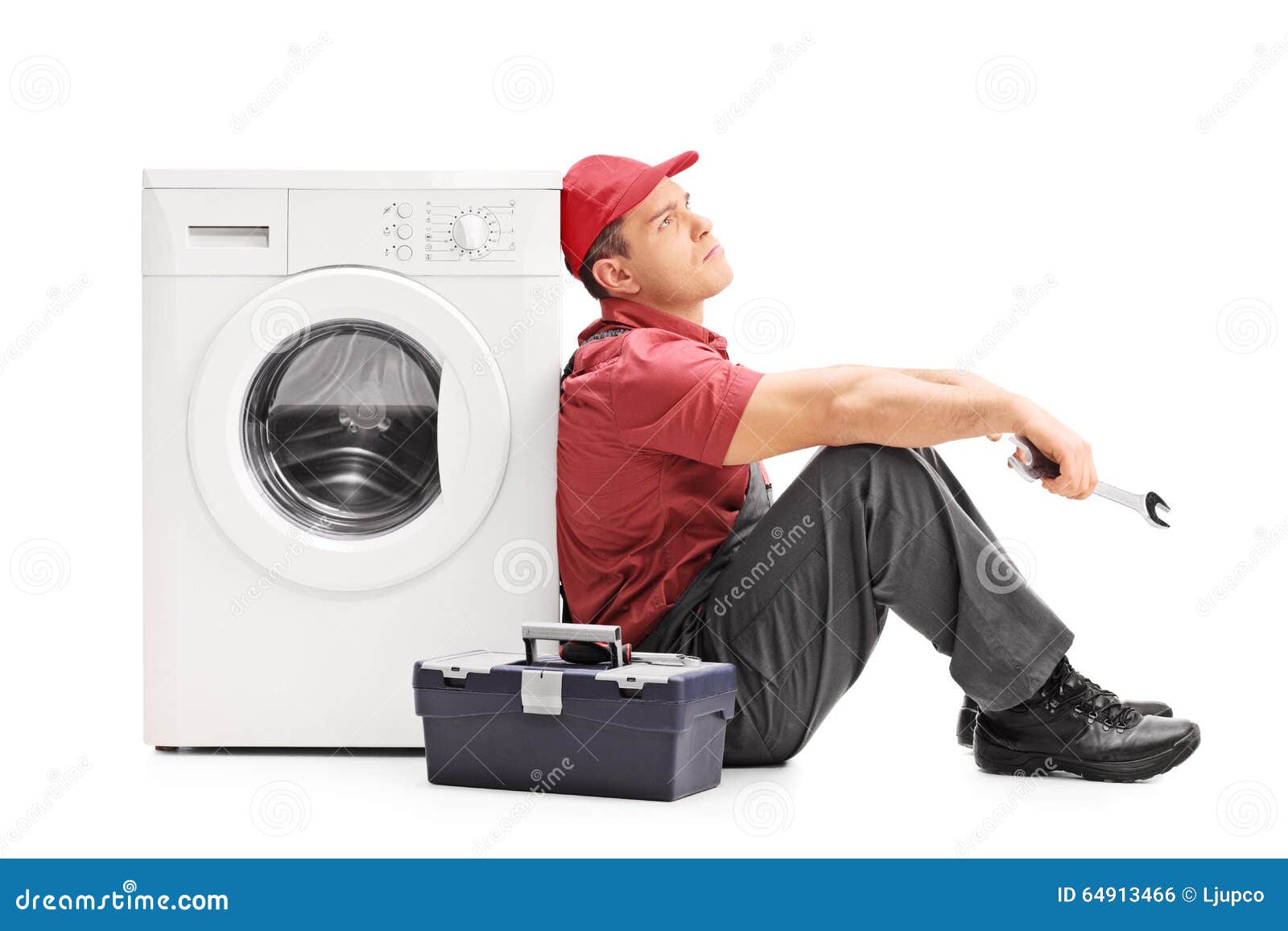 Plumber Sitting by a Washing Machine and Thinking Stock Photo - Image ...