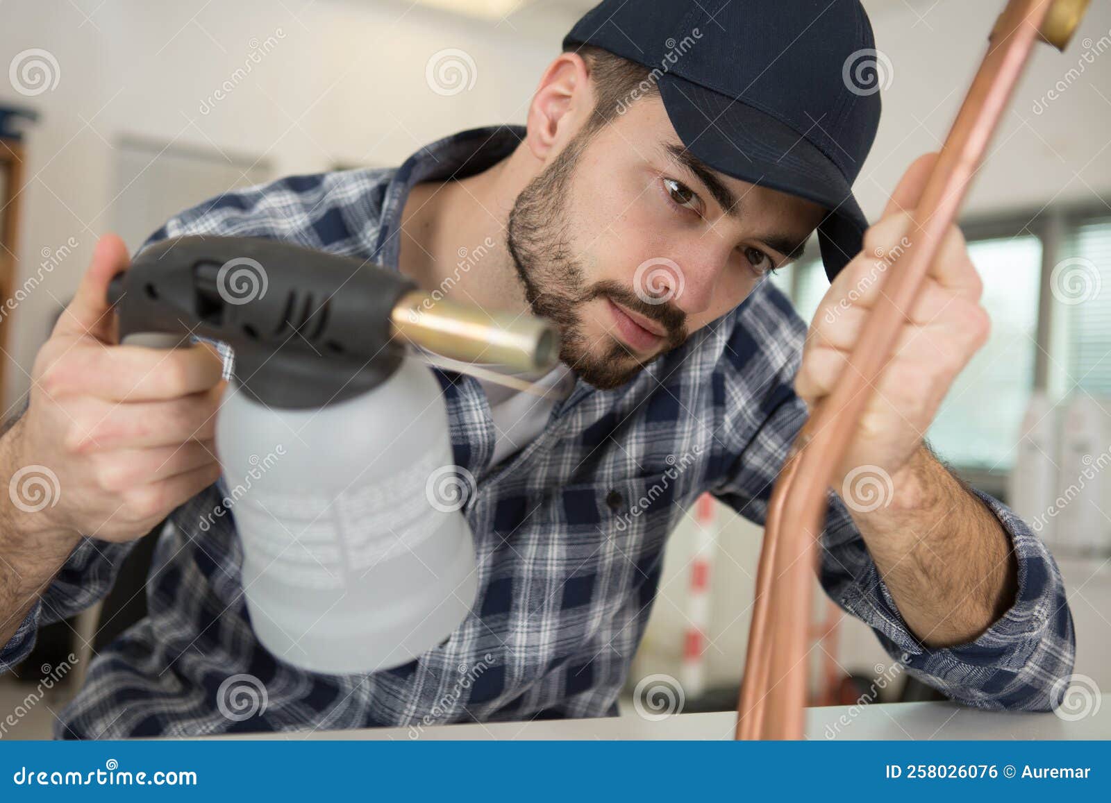 Plumber soldering pipe stock photo. Image of plumbing - 258026076