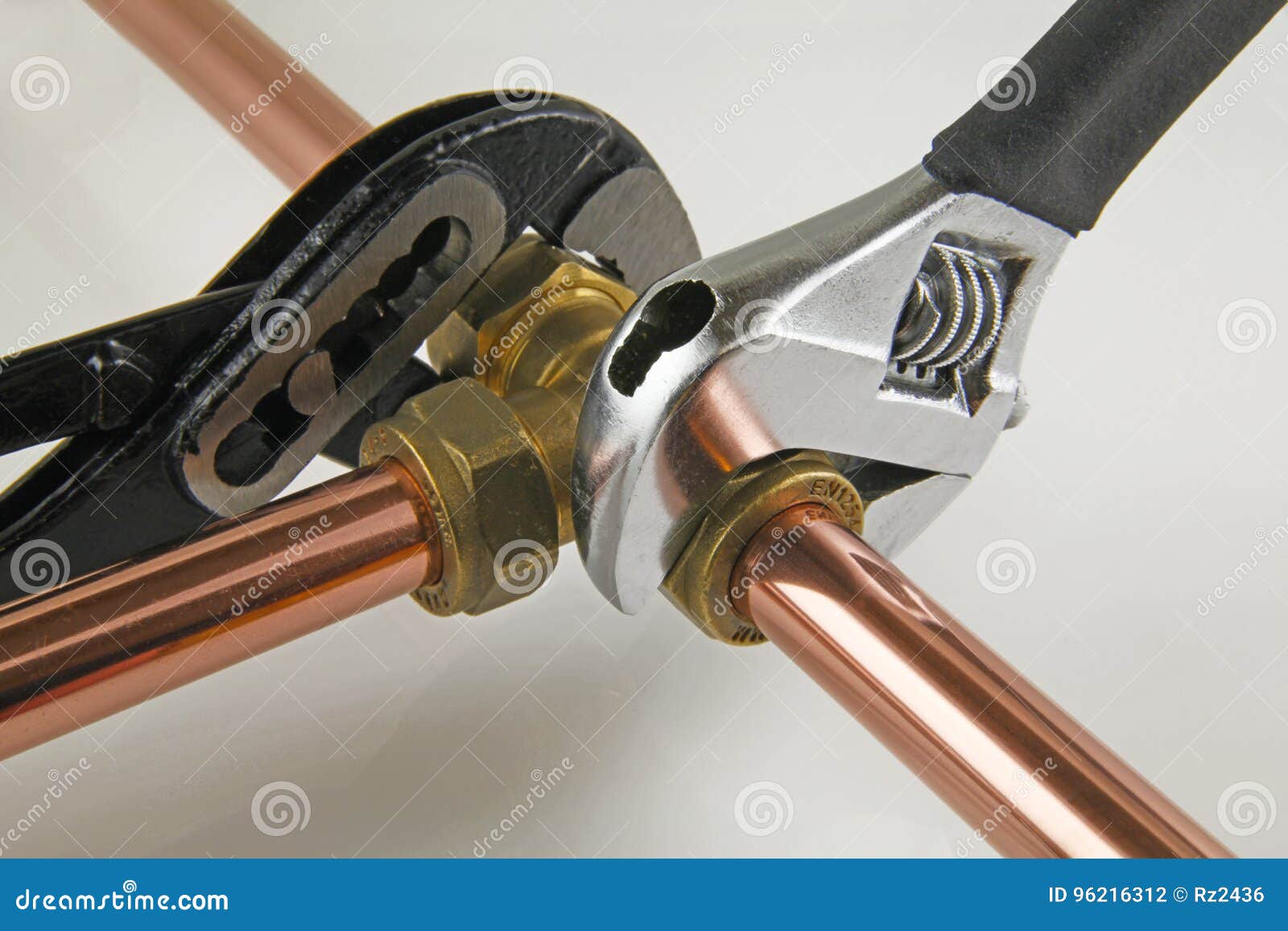 Plumber Tightening Up Pipework Stock Photo - Image of brass, plumbing ...