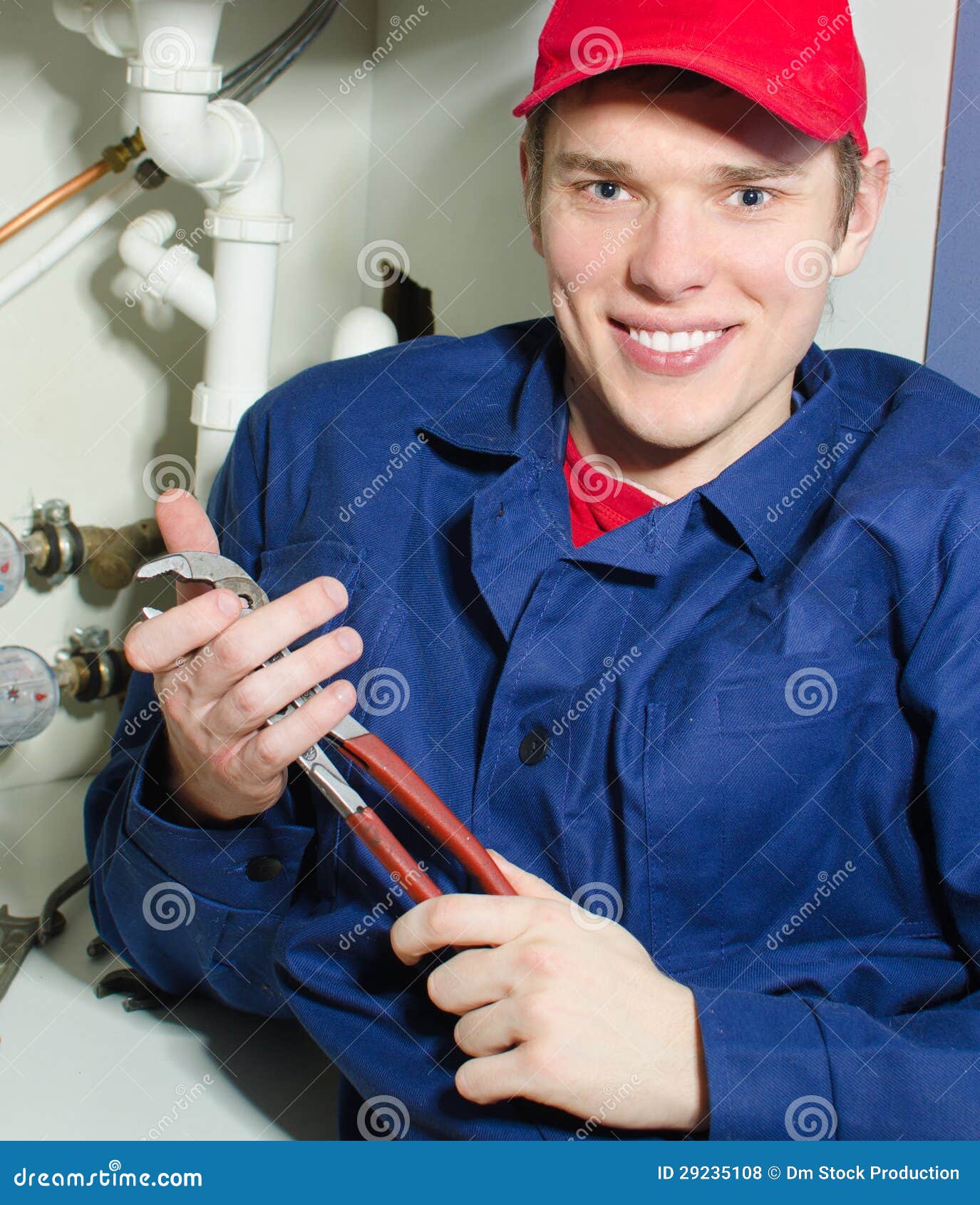 Plumber in uniform stock photo. Image of happy, holding - 29235108