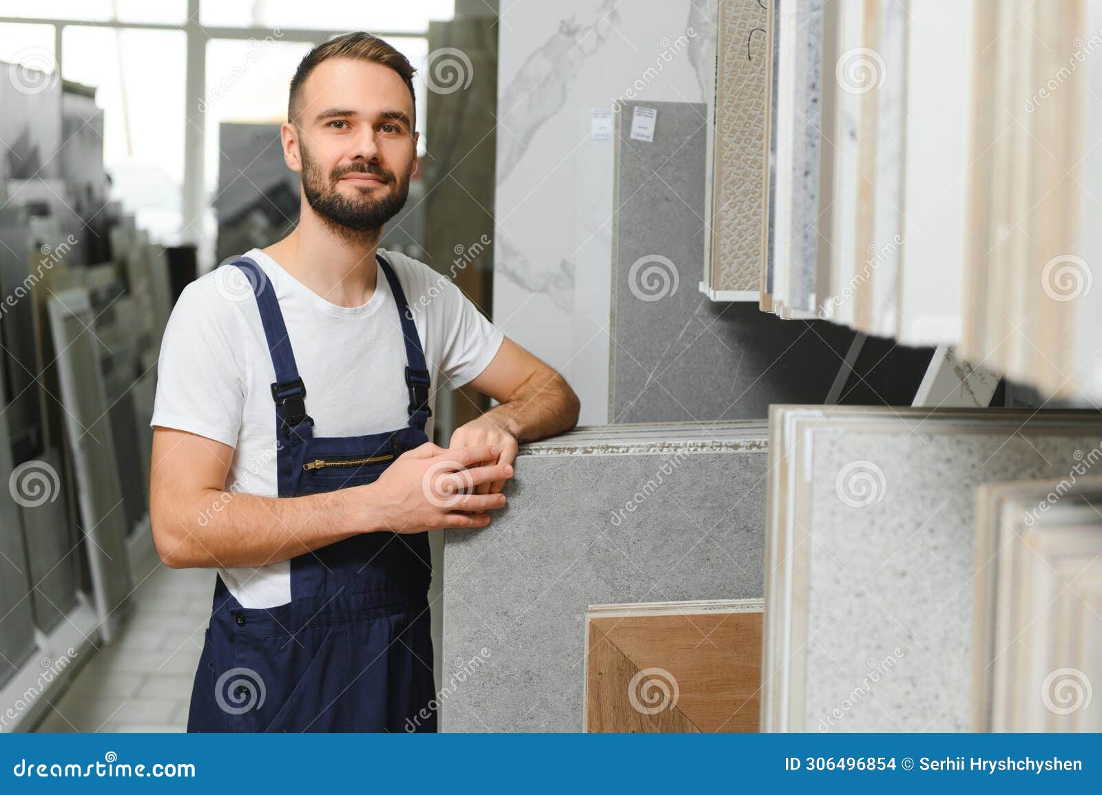 Plumber in Uniform at Showcase in Plumbering Store Stock Photo - Image ...