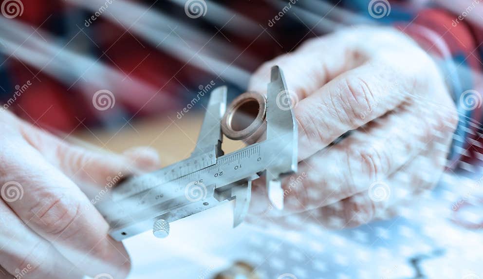Plumber Using a Caliper Light Effect Stock Image - Image of hand ...