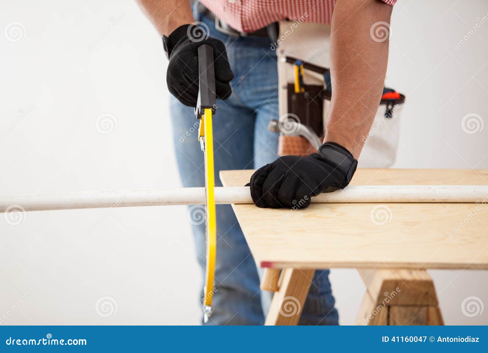 Plumber using a hacksaw stock image. Image of cutting - 41160047