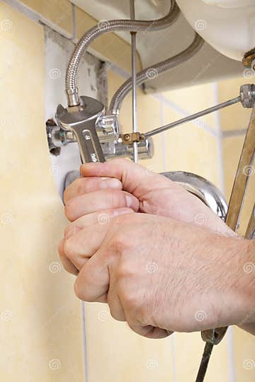 Plumber at work stock photo. Image of equipment, construction - 20762860