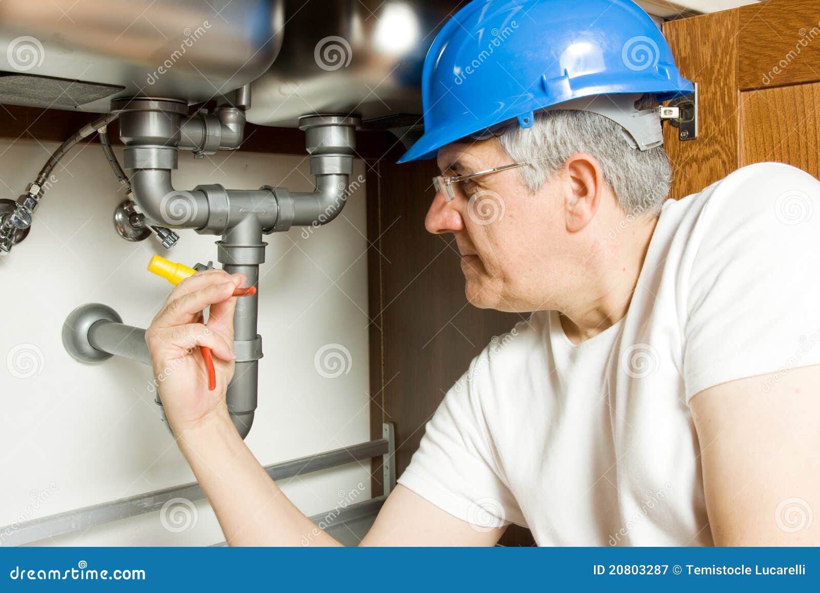 Plumber at work stock image. Image of industry, janitor - 20803287