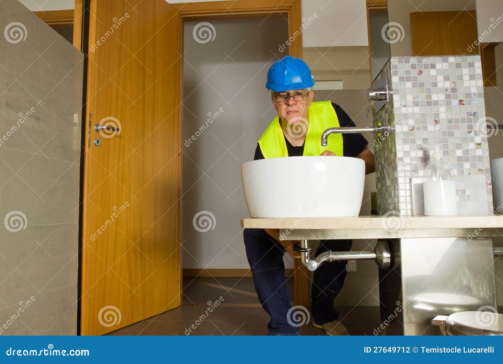 Plumber at work stock photo. Image of pipe, plumber, handyman - 27649712