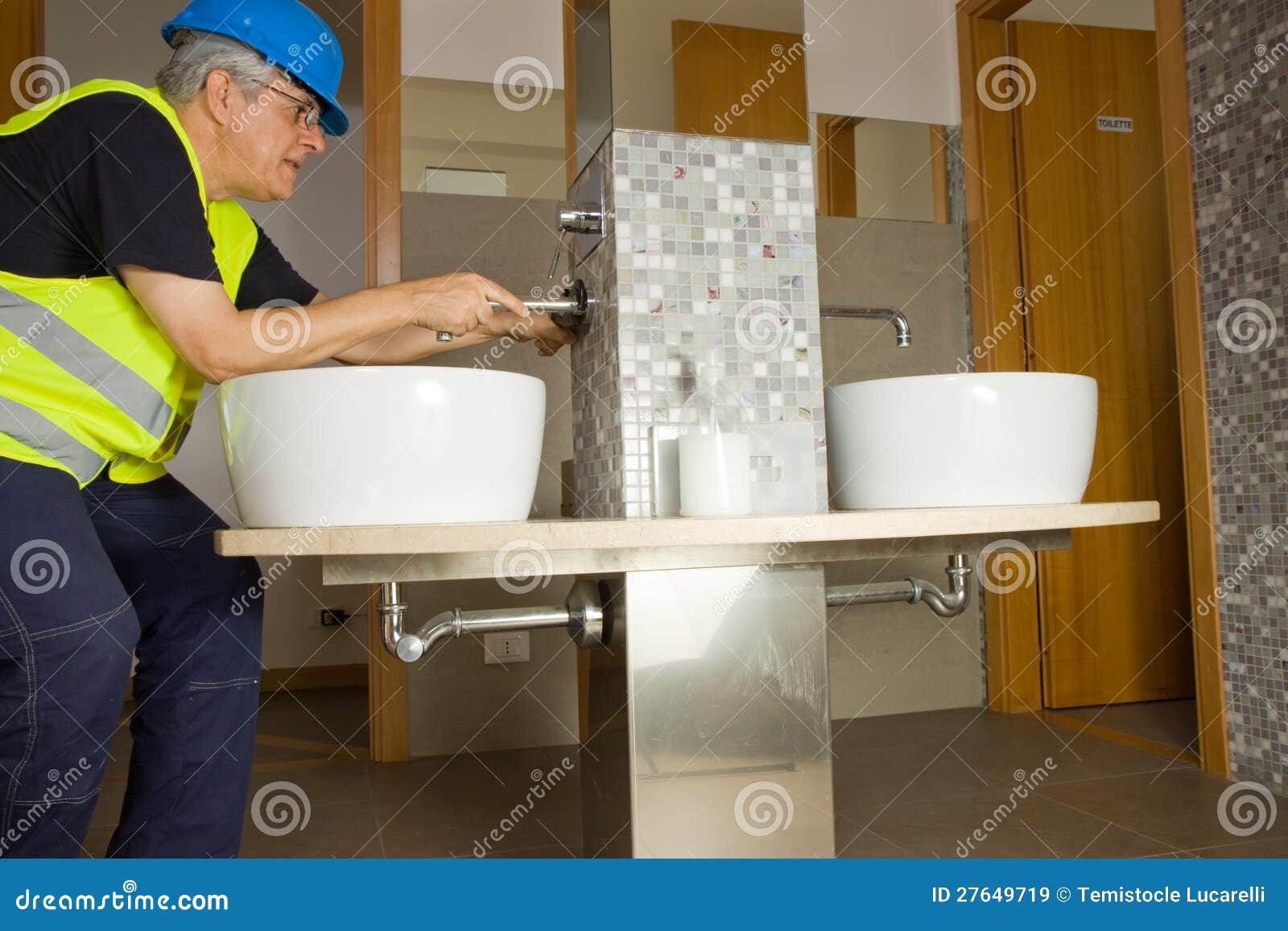 Plumber at work stock image. Image of repairman, plumbing - 27649719