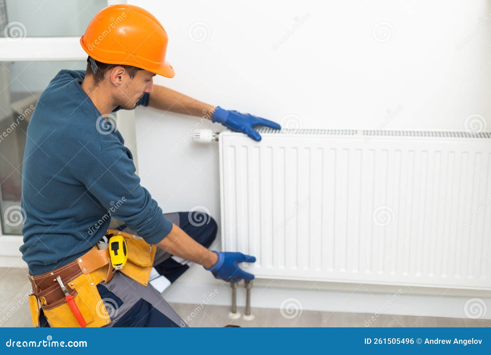 Plumber at Work. Installing Water Heating Radiator Stock Photo - Image ...