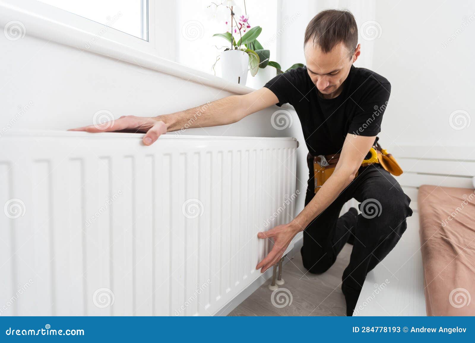 Plumber at Work. Installing Water Heating Radiator Stock Image - Image ...