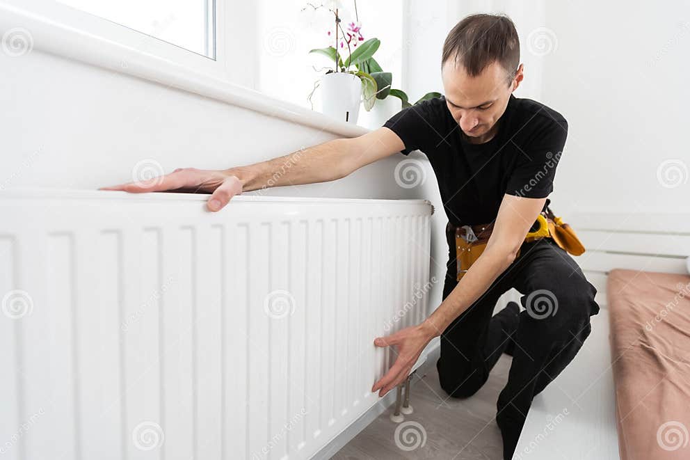 Plumber at Work. Installing Water Heating Radiator Stock Image - Image ...