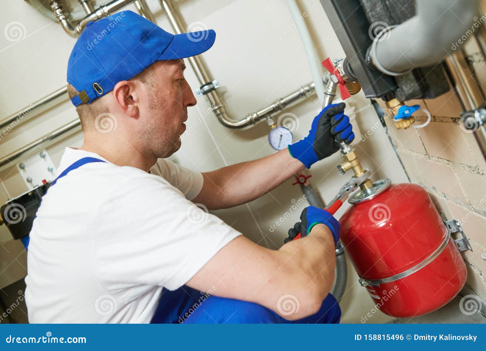 Plumber Work. Installing Water Storage into System Stock Photo - Image ...