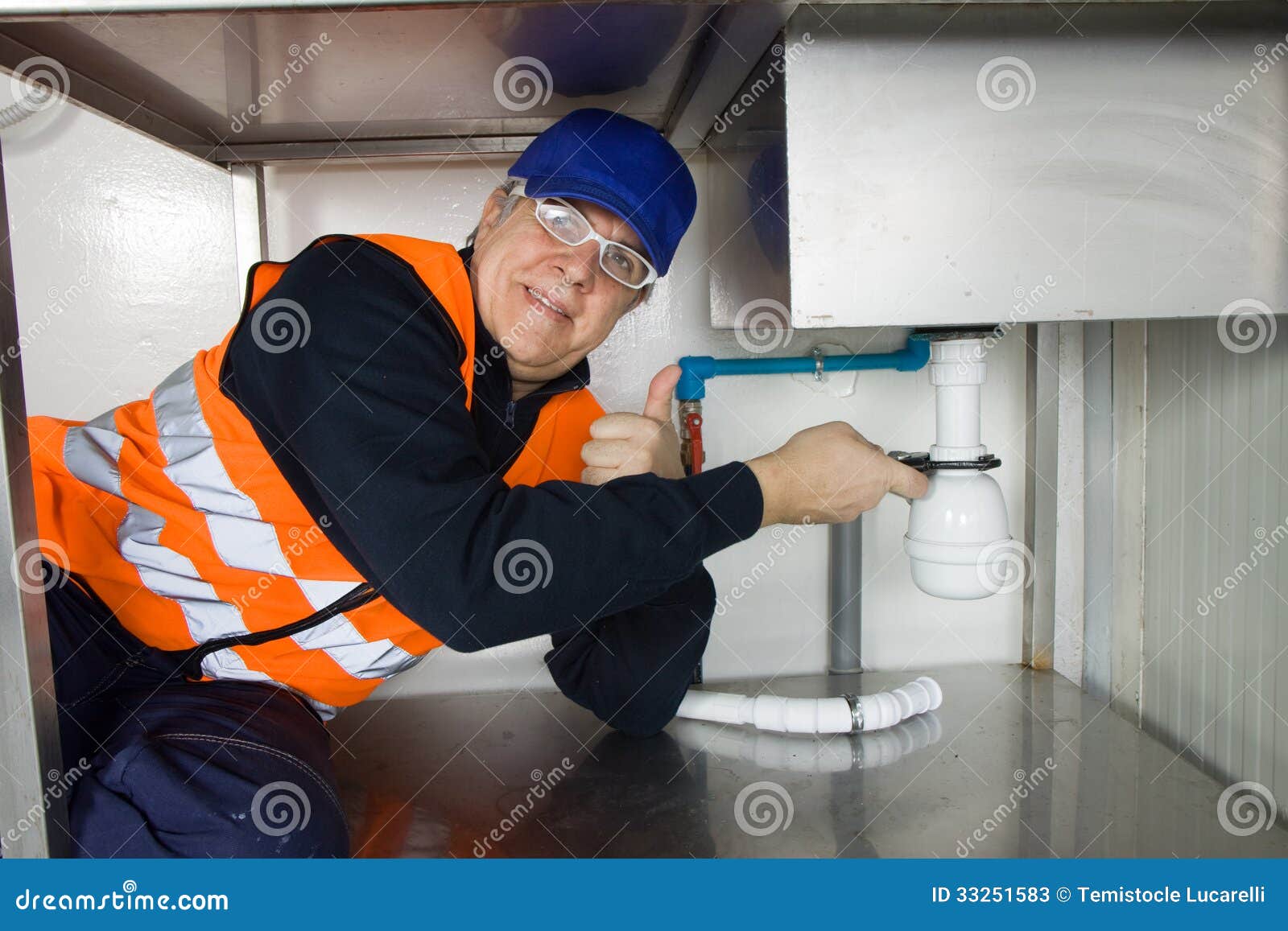 Plumber at work stock image. Image of homeowner, janitor - 33251583