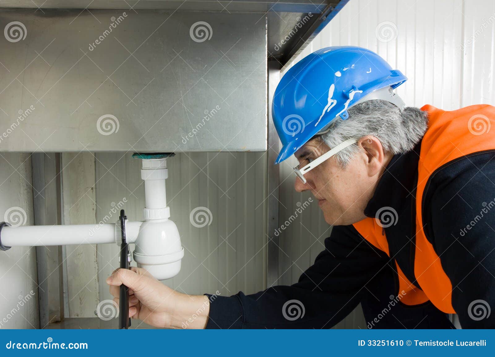 Plumber at work stock photo. Image of maintenance, brick - 33251610
