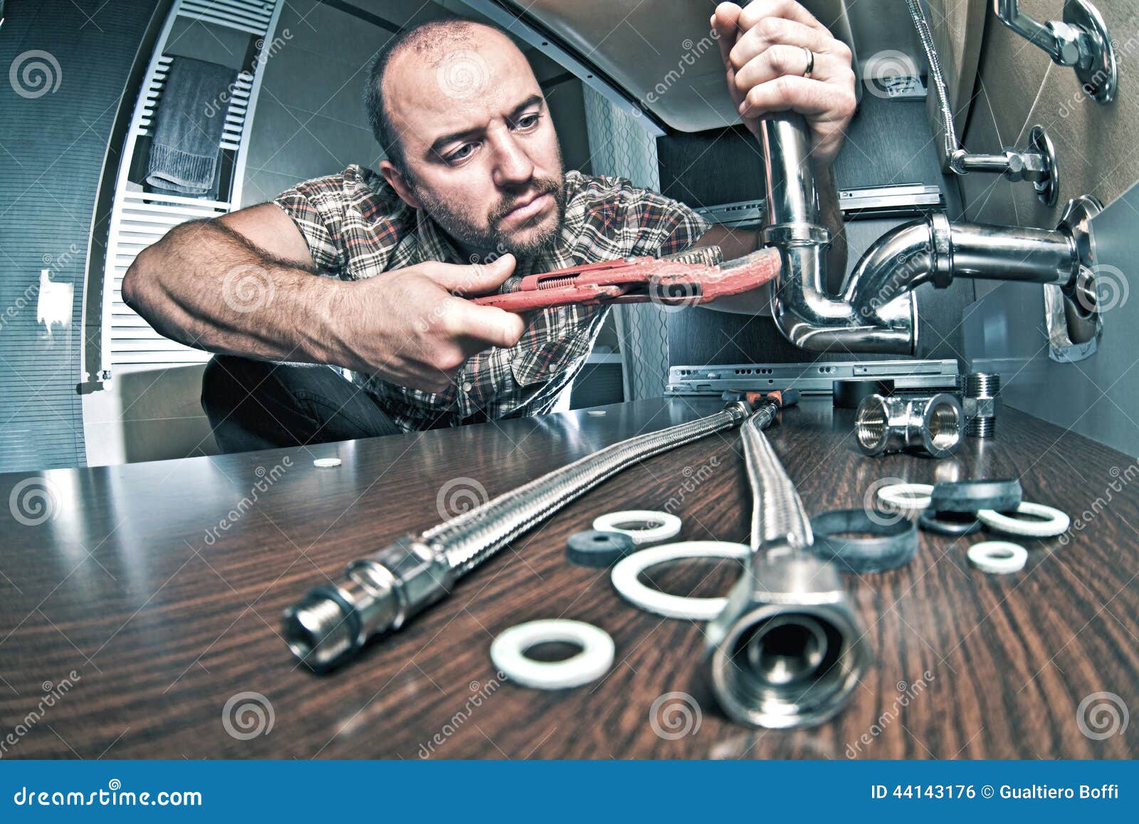 Plumber at work stock photo. Image of contractor, maintenance - 44143176