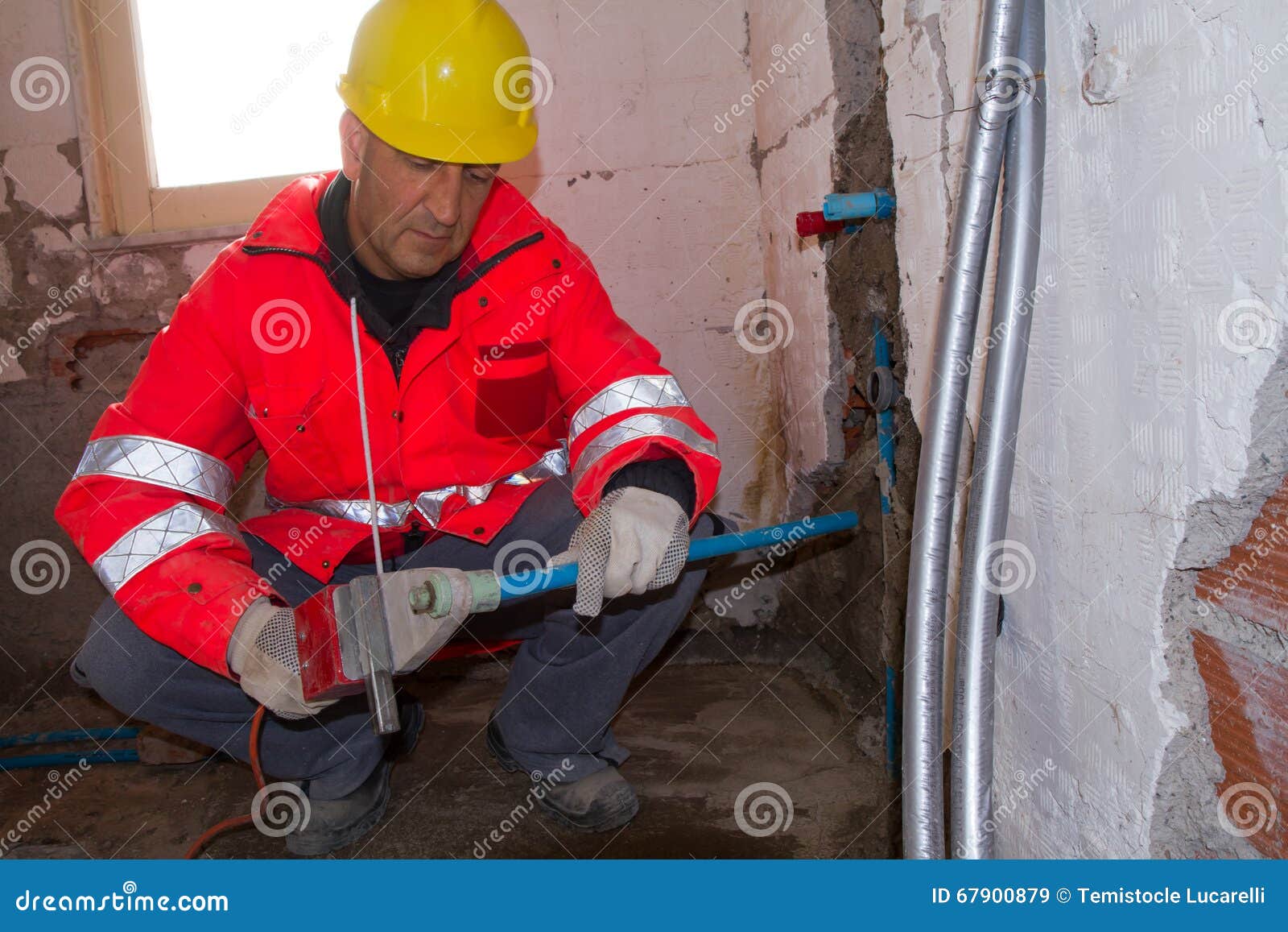 Plumber at work in a site stock image. Image of masonry - 67900879