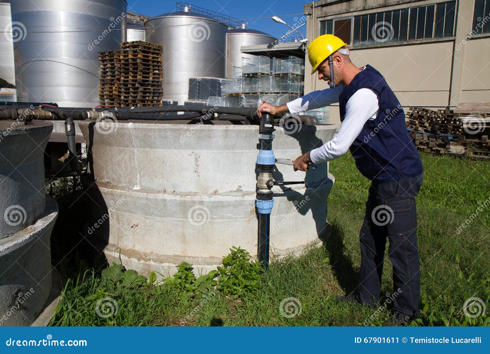 Plumber at work in a site stock image. Image of bricklayer - 67901611