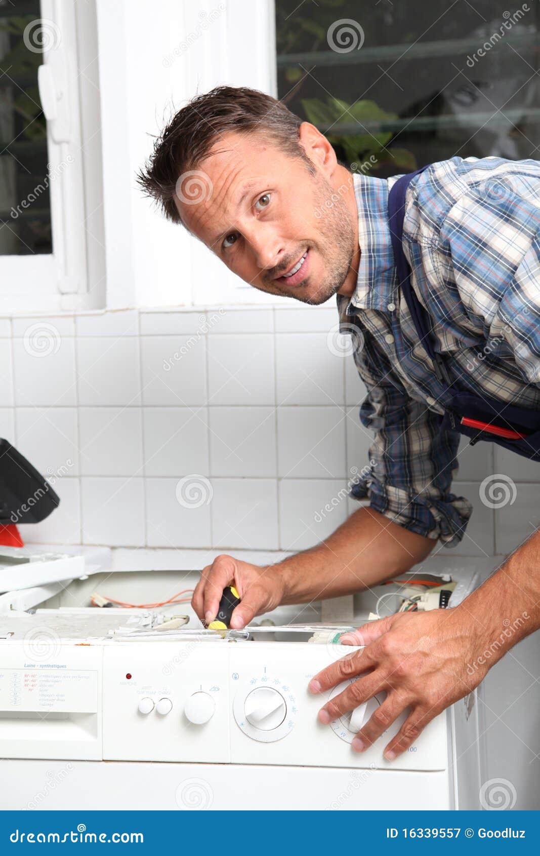 Plumber Working on Domestic Appliance Stock Image - Image of window ...
