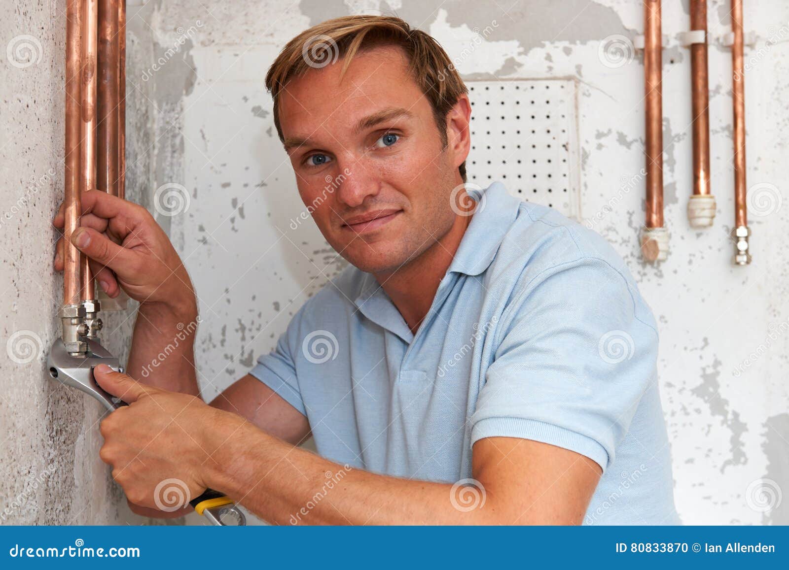 Plumber Working on Pipes at Construction Site Stock Photo - Image of ...