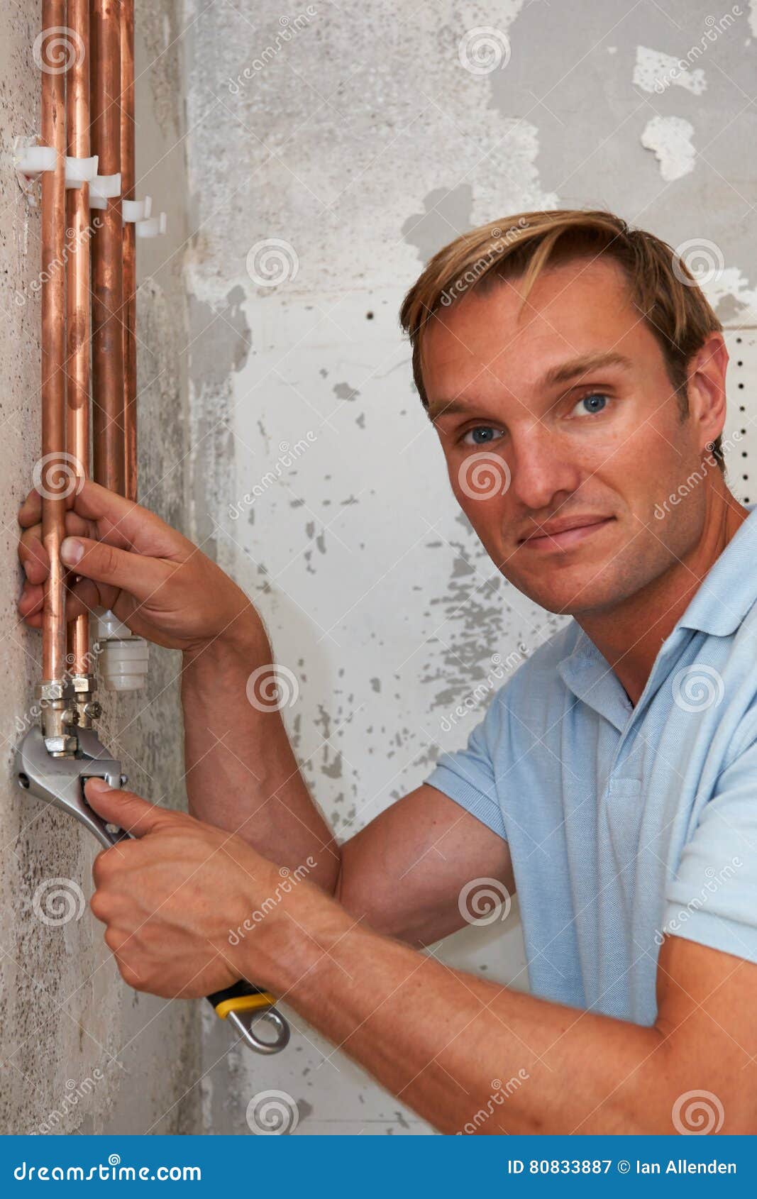 Plumber Working on Pipes at Construction Site Stock Image - Image of ...