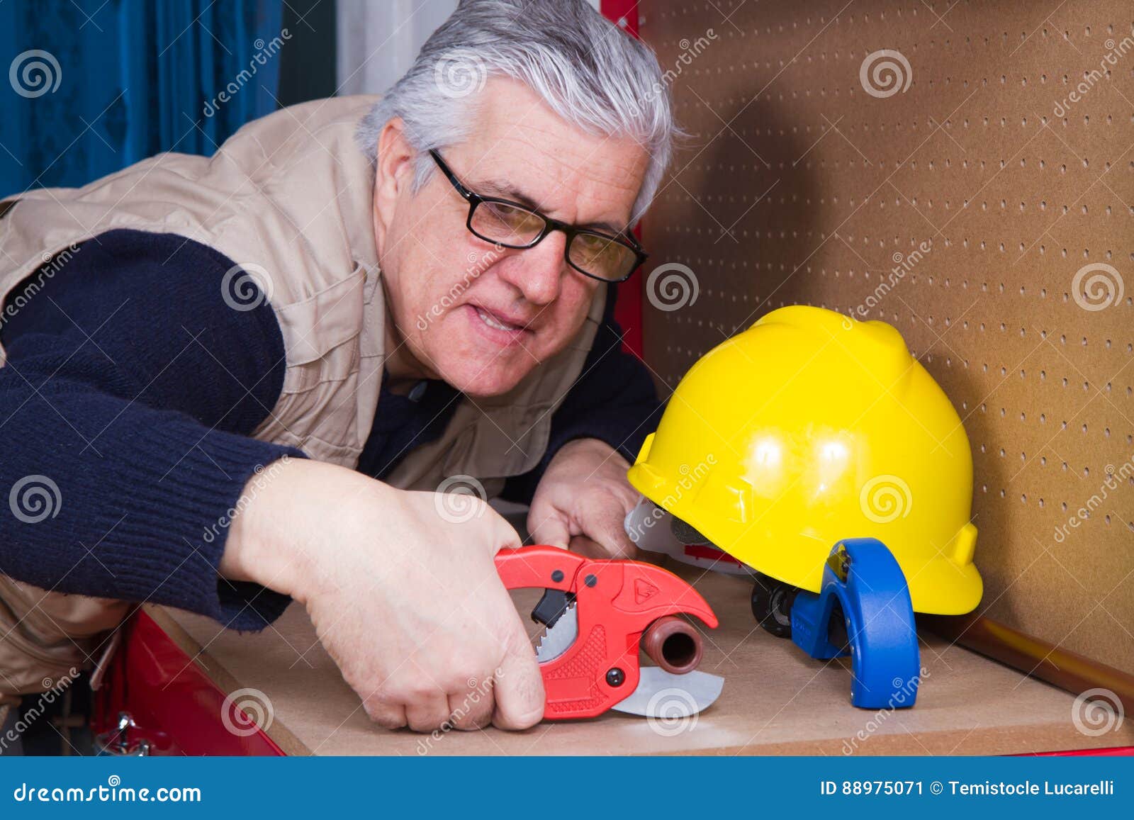 Plumber working with pipes stock image. Image of professional - 88975071