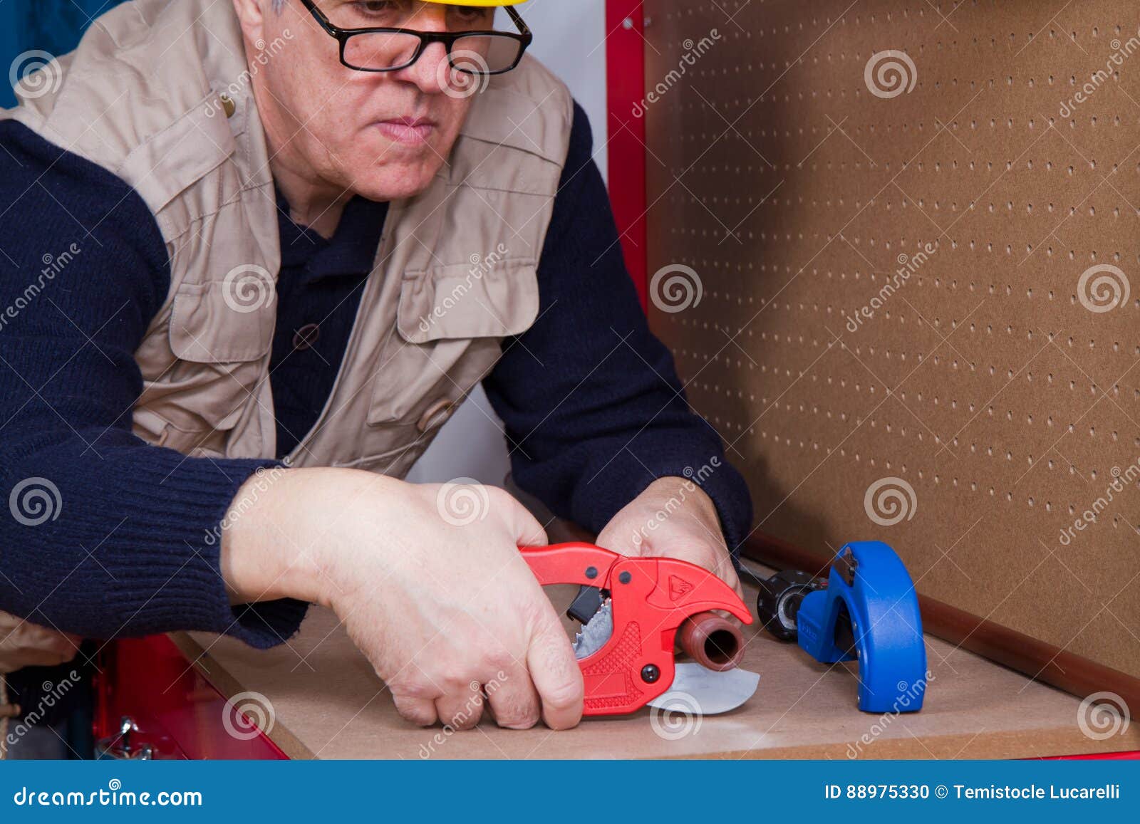 Plumber working with pipes stock photo. Image of janitor - 88975330