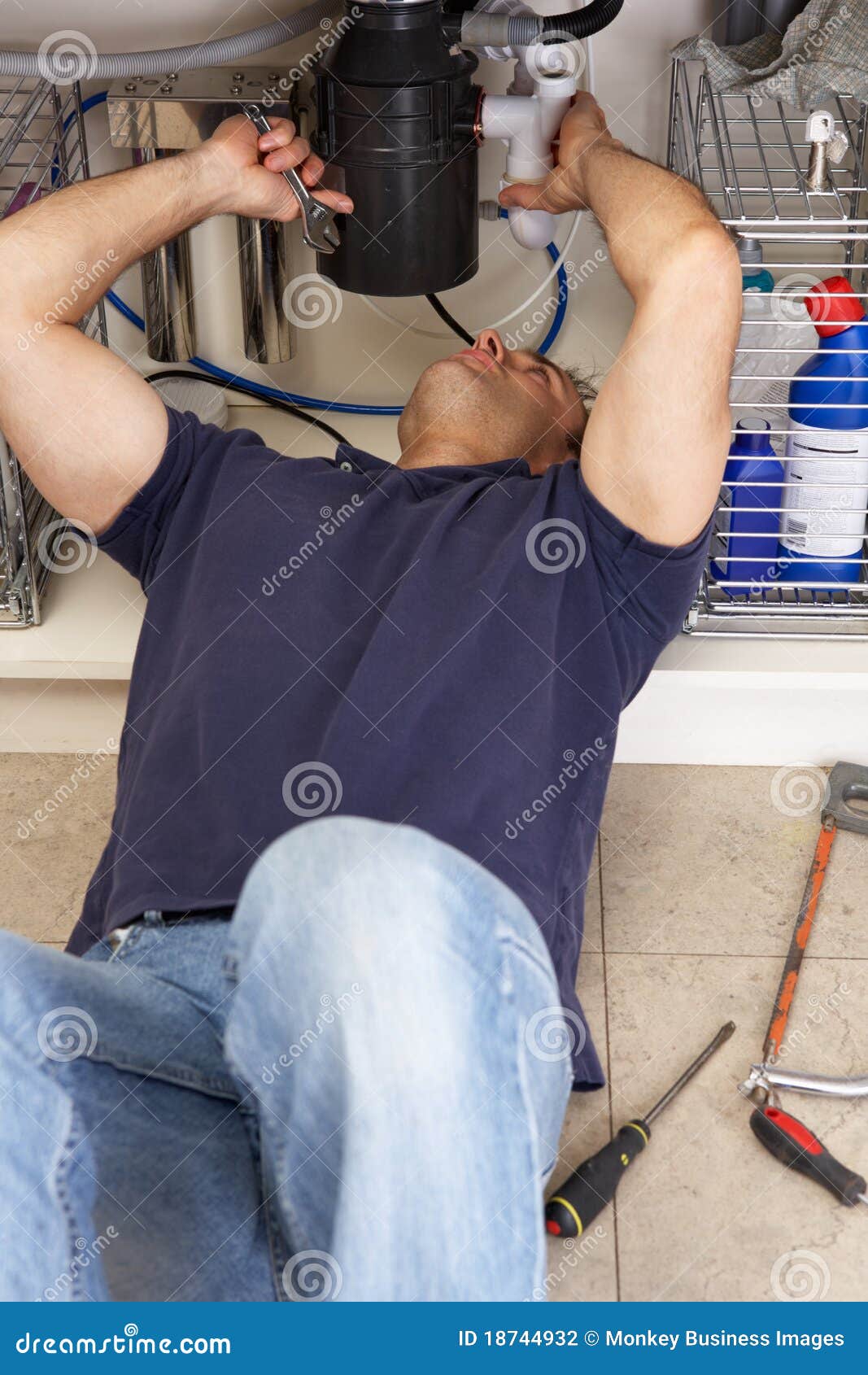 Plumber Working on Sink stock photo. Image of vertical - 18744932