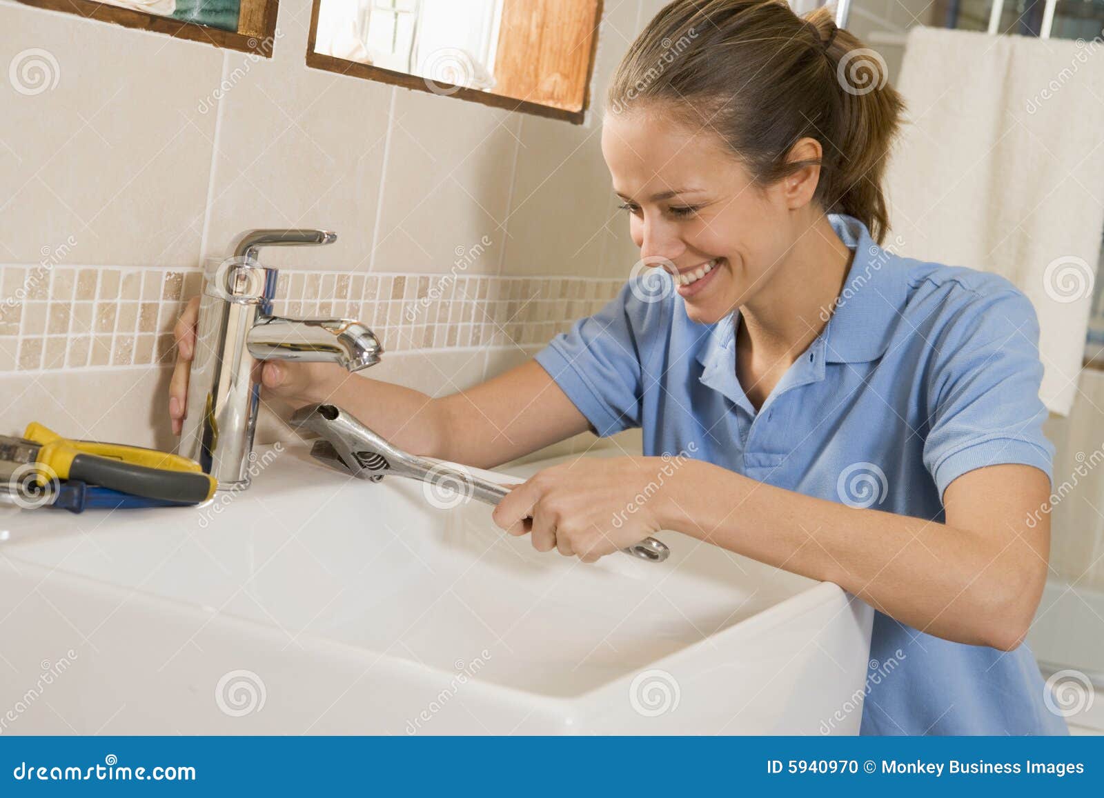 Plumber working on sink stock photo. Image of quarter - 5940970