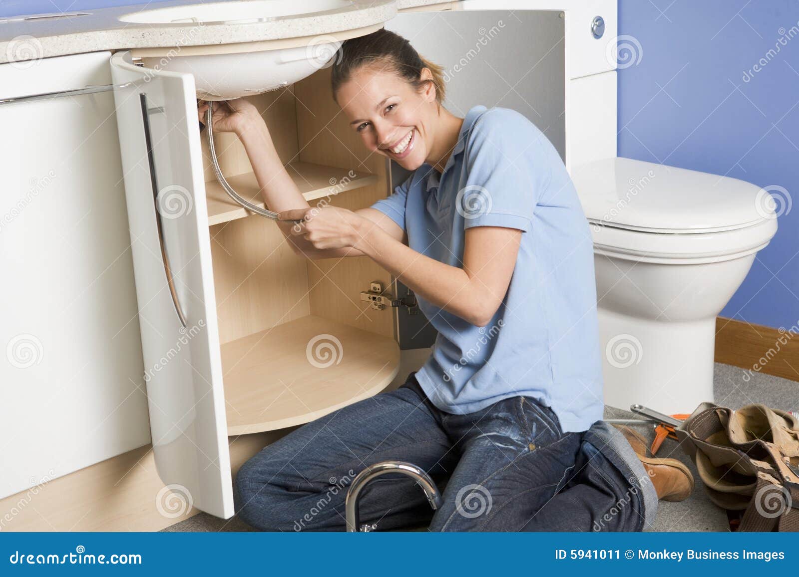 Plumber Working on Sink Smiling Stock Image - Image of sink, self: 5941011