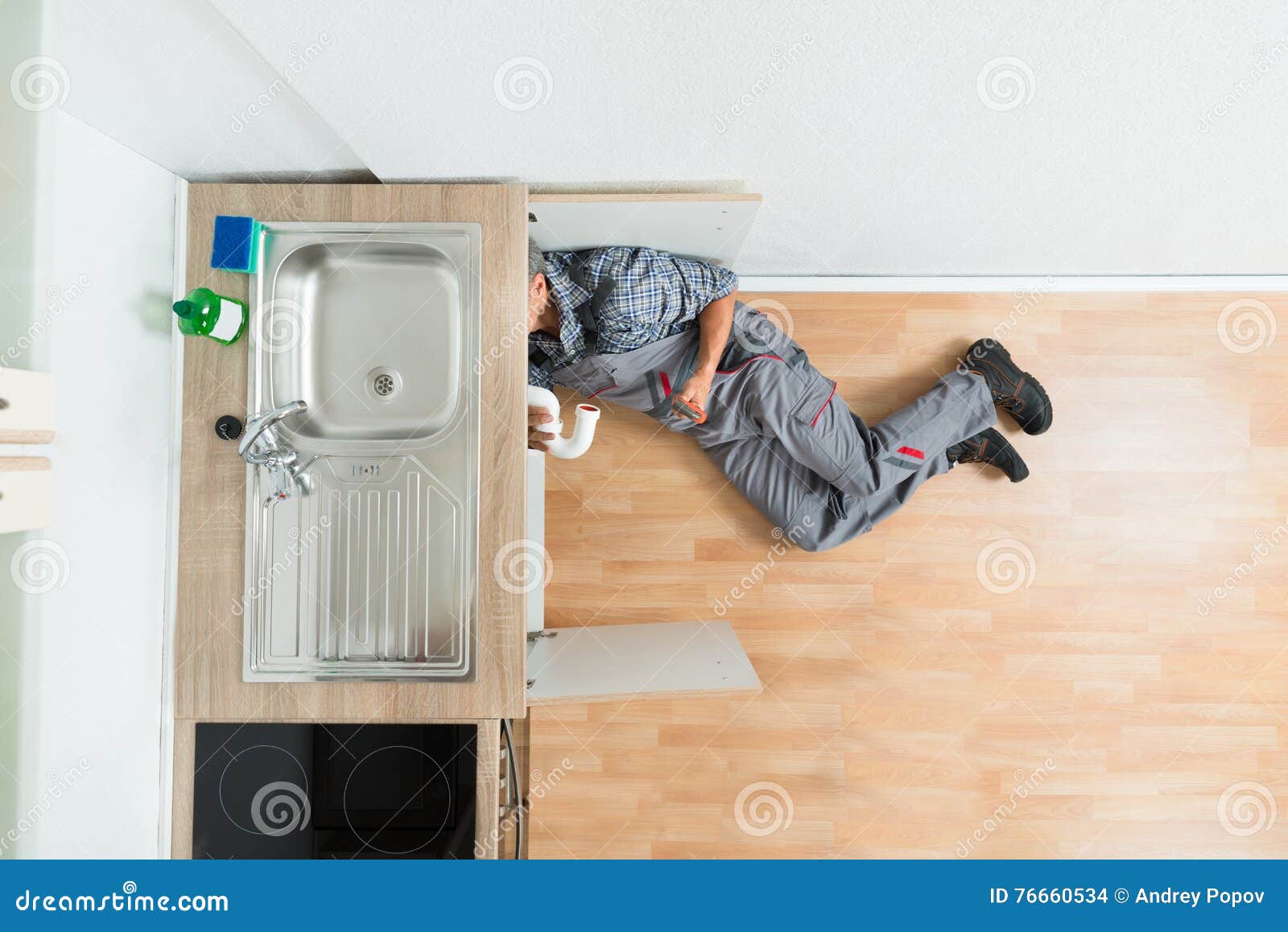 Plumber Working Under Kitchen Sink Stock Photo - Image of handyman ...