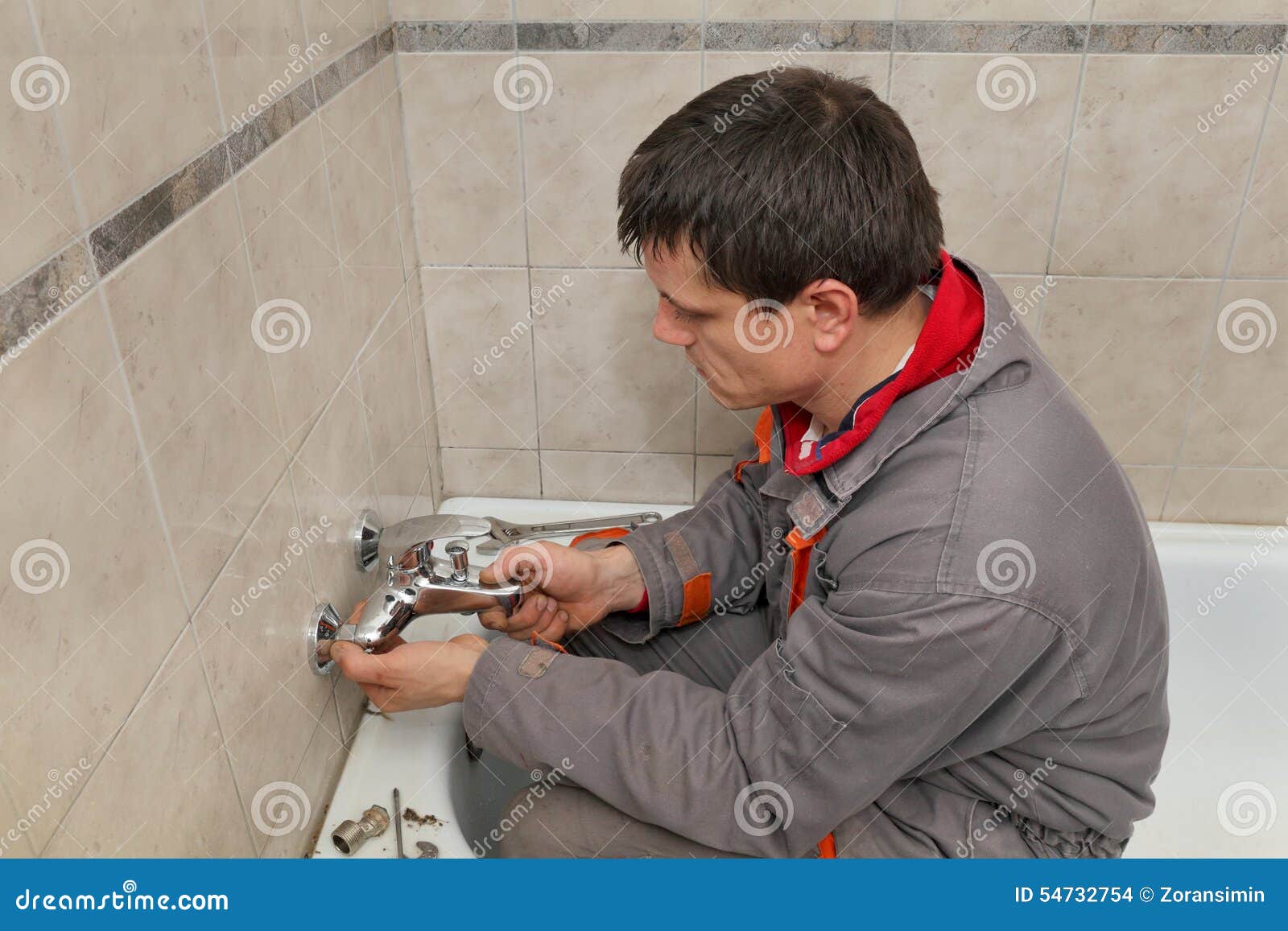 Plumber Works in a Bathroom Stock Photo - Image of spanner, color: 54732754