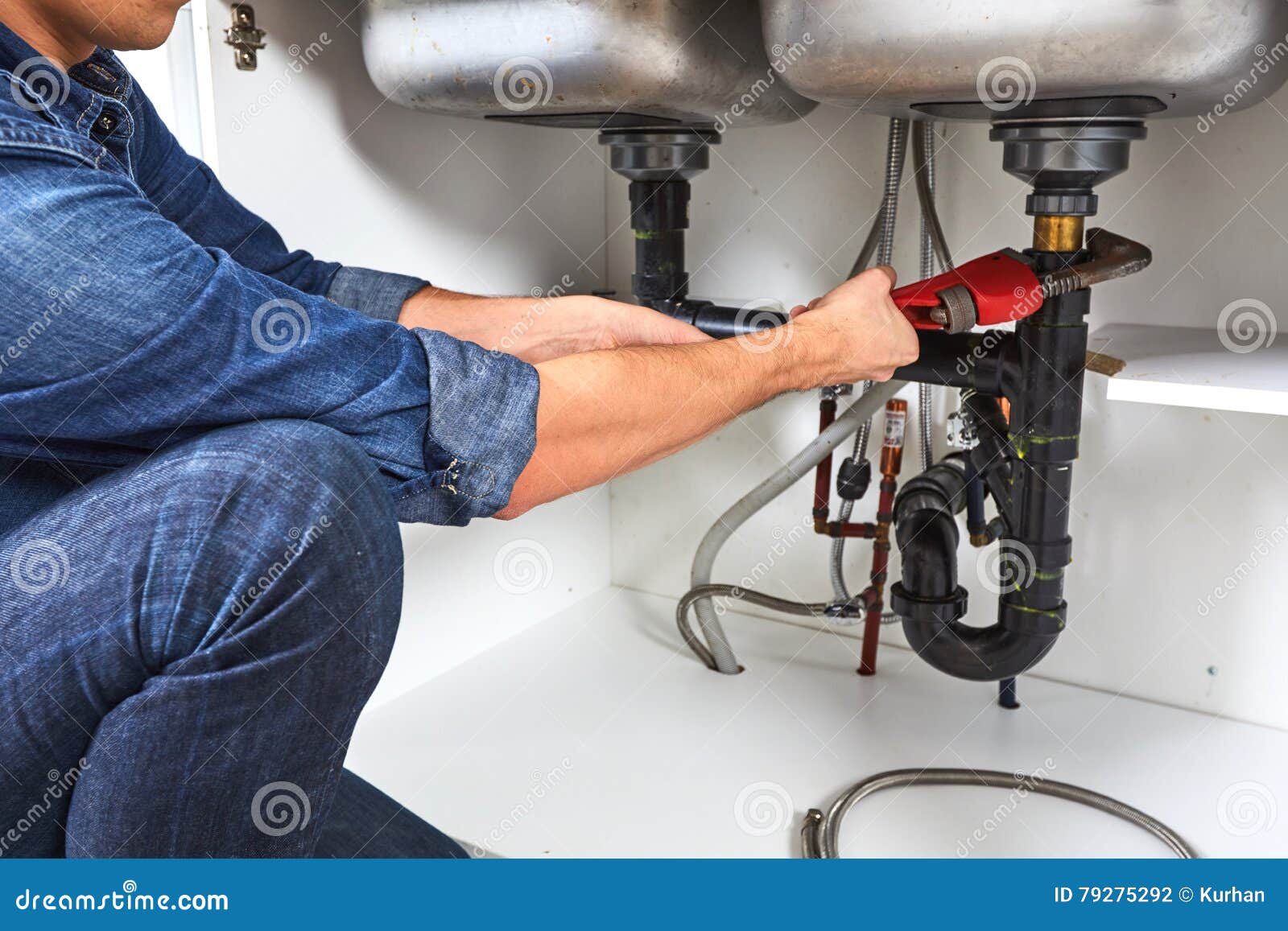 Plumber with wrench. stock photo. Image of renovation - 79275292