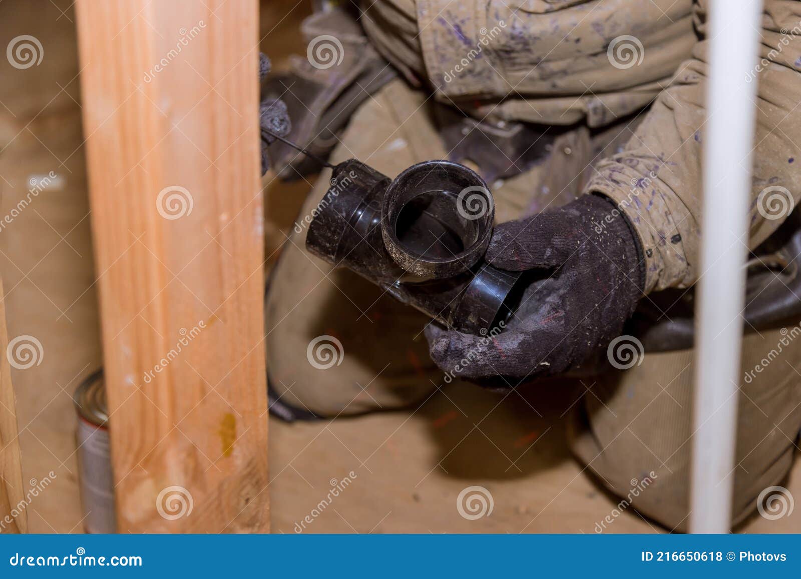 Plumbing Contractor Installing PVC Plastic Drain Pipe in the Section ...