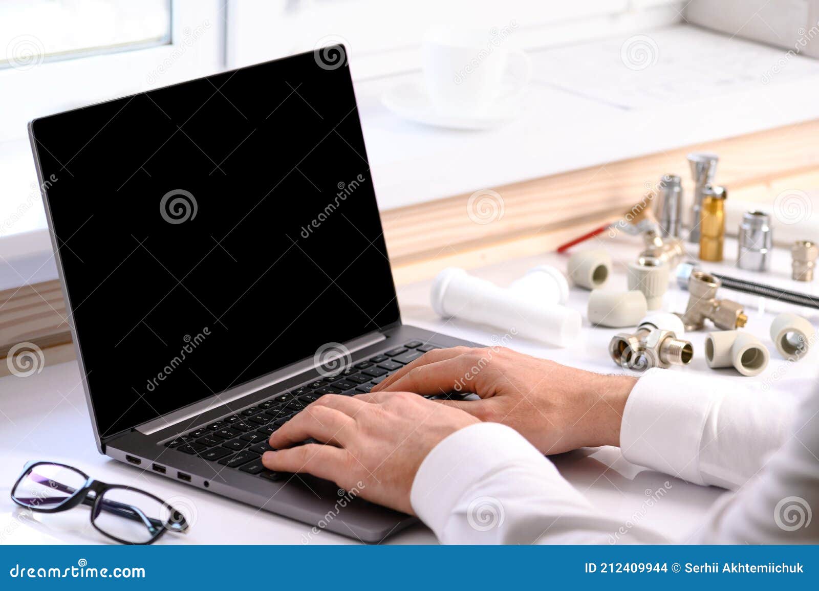 . Plumbing Courses. on the Table are a Computer and Accessories for the ...