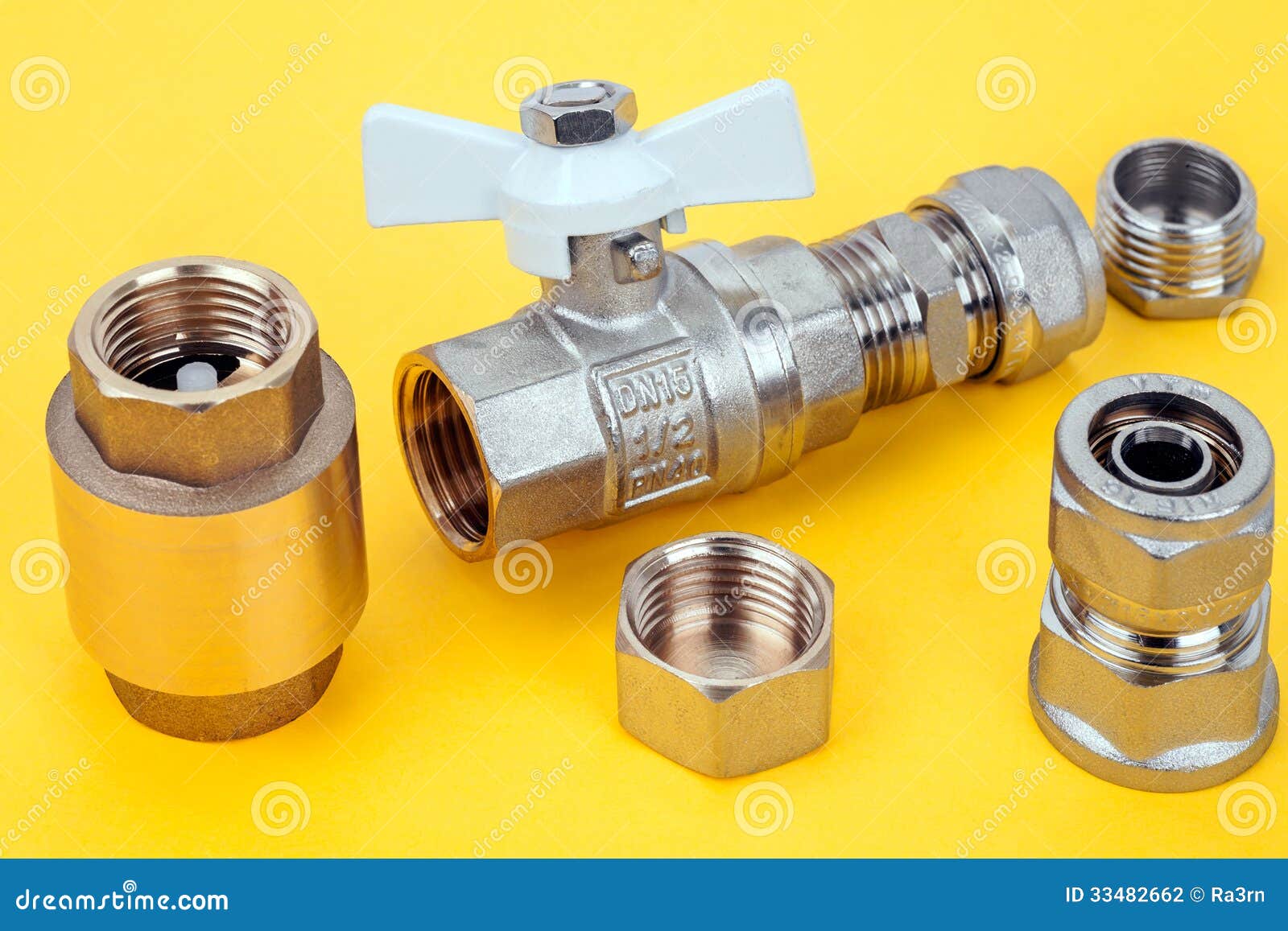 Plumbing parts on yellow stock photo. Image of parts - 33482662